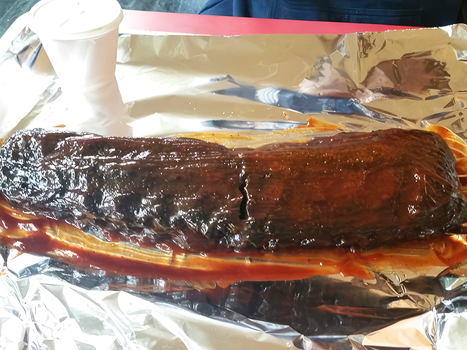 These ribs aren't "falling off the bone" &ndash; they're showing proper respect by maintaining their dignity while still surrendering perfectly to each bite.