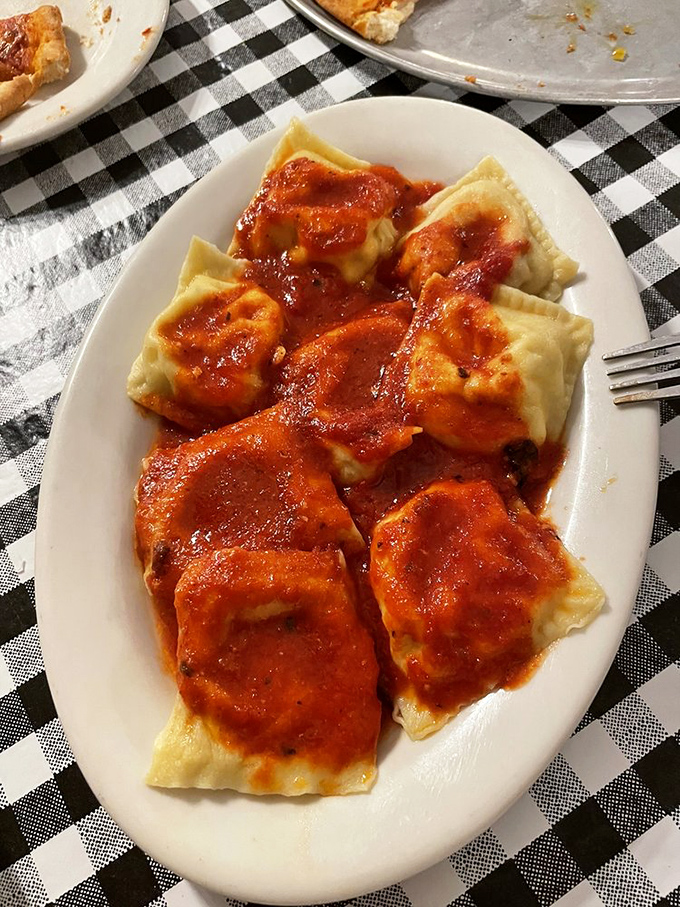 Ravioli swimming in marinara like happy little pillows of joy. Each bite is a reminder that simplicity, done right, is culinary genius.