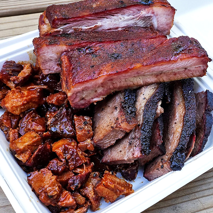 The holy trinity of barbecue: ribs with the perfect bite, brisket with textbook bark, and spicy Korean pork that defies categorization.