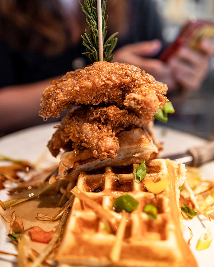 The chicken and waffle tower stands like the Eiffel Tower of breakfast&mdash;majestic, awe-inspiring, and guaranteed to draw gasps from neighboring tables.
