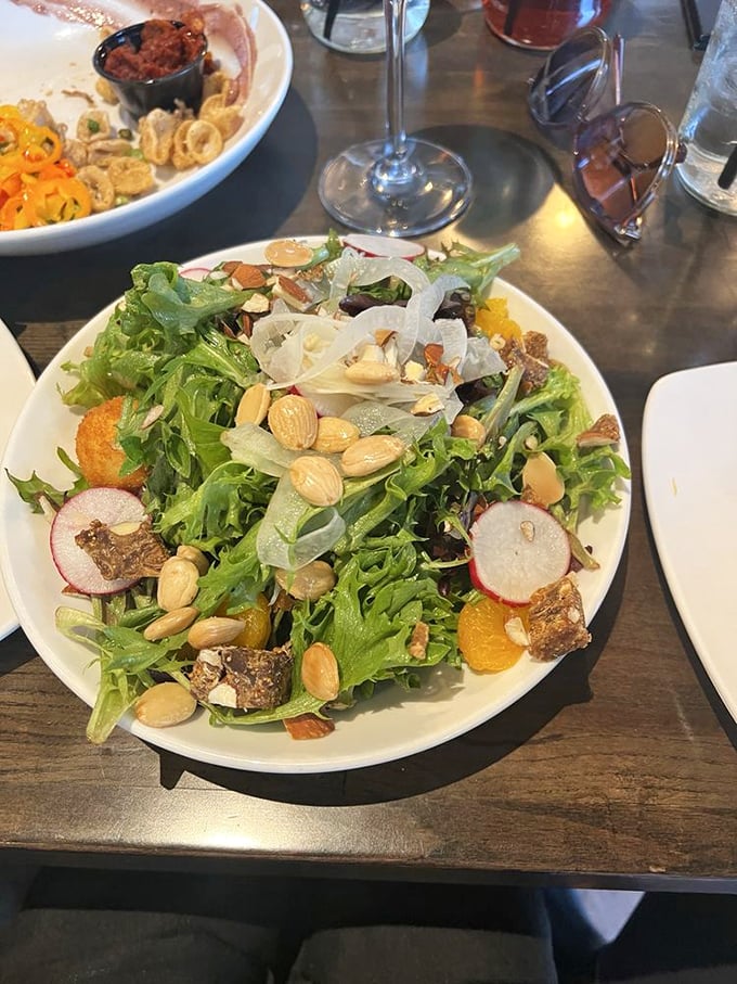 Even the salad refuses to be boring at Mussel & Burger Bar. Those almonds and radishes aren't just toppings&mdash;they're little flavor bombs waiting to detonate on your taste buds.