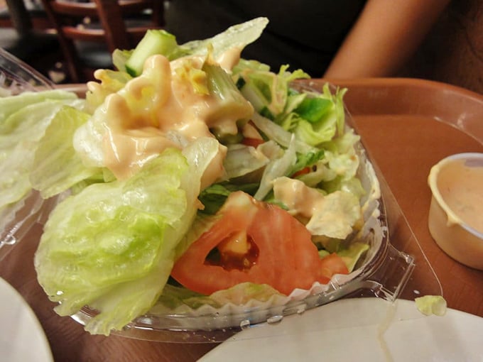 The salad you order to convince yourself you're making healthy choices before demolishing a sandwich the size of your head.