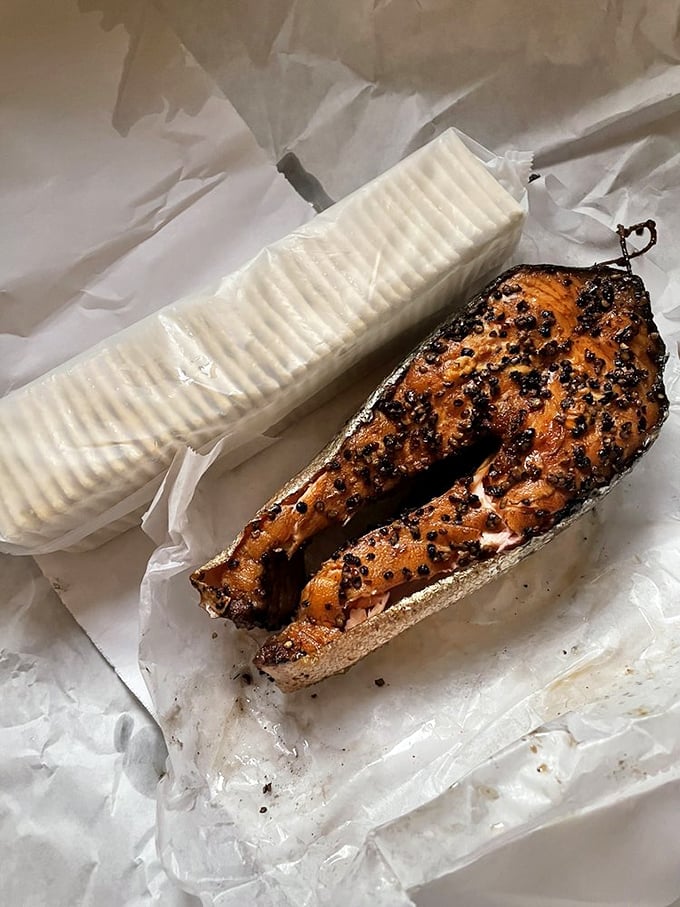 The pepper-crusted salmon that launched a thousand road trips. This spice-encrusted beauty shows why smoke and salmon were destined to be together.