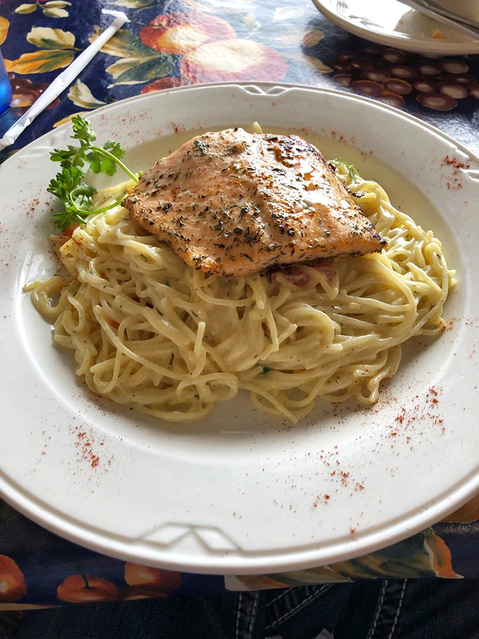Their salmon linguine isn't just a dish&mdash;it's a love letter to simplicity, with perfectly cooked fish resting on a bed of creamy pasta. 