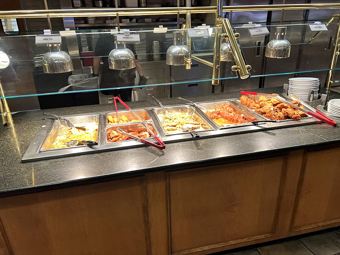 The buffet line where life-changing decisions are made. "Should I save room for dessert?" is a question best answered with "Yes, and also more chicken."