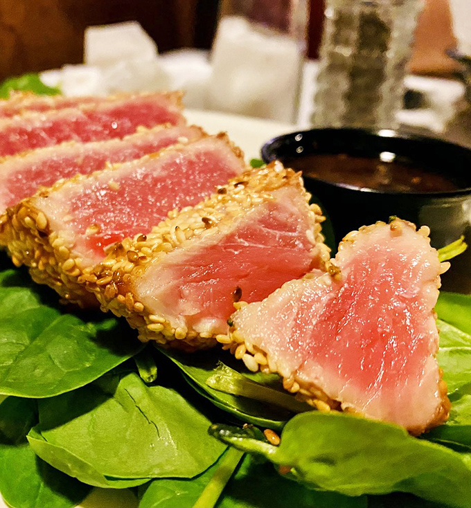 The ahi tuna, dressed in its sesame seed tuxedo, brings a touch of coastal elegance to this temple of beef.