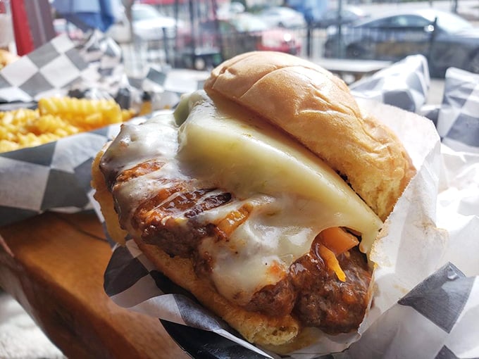Meet the Shocker burger, where melty cheese cascades over beef like a dairy waterfall. Worth every napkin you'll sacrifice to the cause.