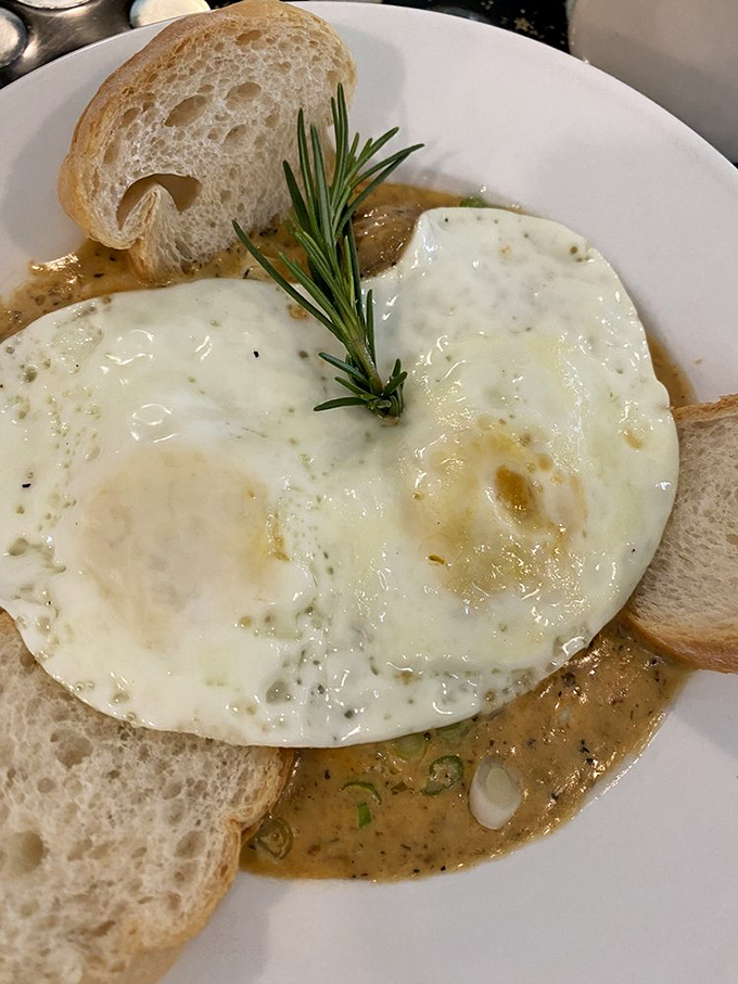 When breakfast can't decide between land and sea, you get this masterpiece &ndash; perfectly cooked eggs crowning a throne of shrimp and grits.