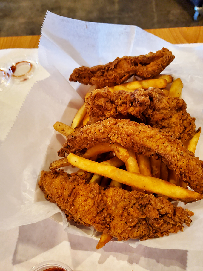 Crispy, golden strips of seafood nestled against french fries. Diet plans silently weep in the distance as you reach for another piece.