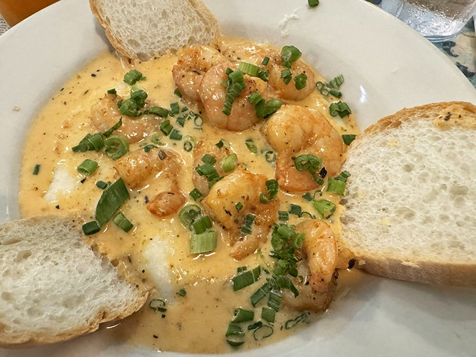 These shrimp aren't just swimming in grits, they're doing the backstroke in creamy, cheesy magnificence with green onion confetti.