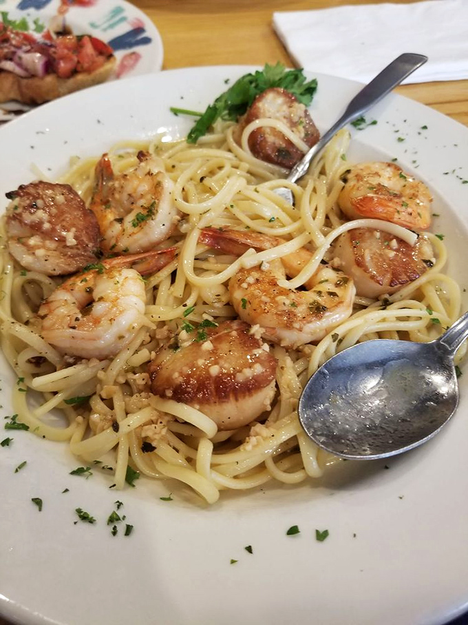 Plump shrimp and scallops nestled in pasta like they were born to be there. The ocean and Italy having a delicious reunion.
