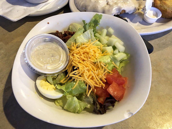 A side salad that acknowledges vegetables have a place at the diner table, even if that place is respectfully next to something fried.