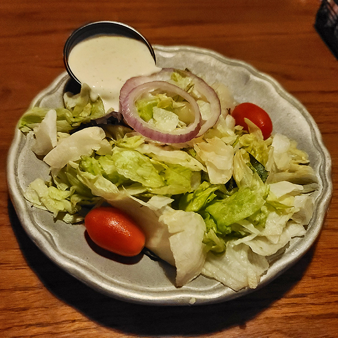 Even the side salad gets special attention&mdash;crisp, fresh, and ready to provide that moment of virtue before the main event.