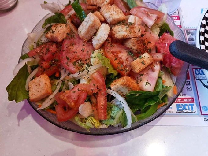 Even the side salad gets the royal treatment&mdash;fresh greens, ripe tomatoes, and house-made croutons that weren't born in a factory.