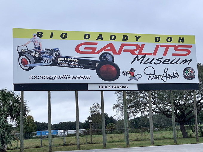 Highway signage that promises exactly what it delivers: a date with "Big Daddy" and his magnificent machines.