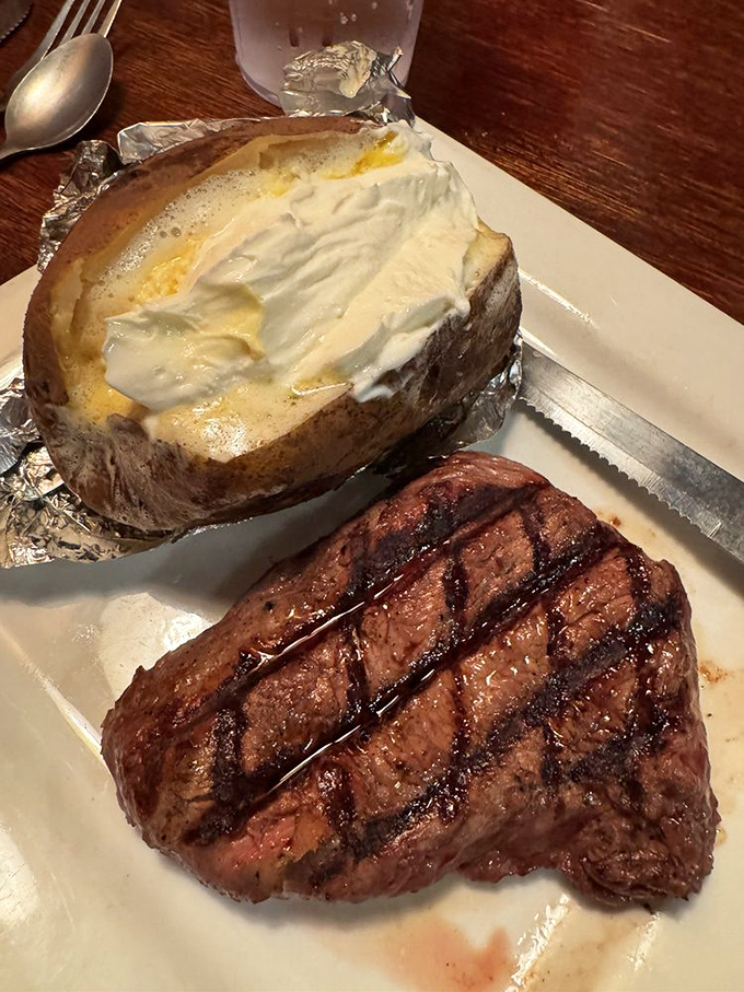 A steak that's been kissed by fire and a baked potato loaded with enough toppings to qualify as its own food group.