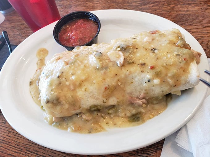 This smothered breakfast burrito isn't just breakfast&mdash;it's a commitment. Wrapped in a tortilla blanket and tucked in with green chile, it's morning comfort defined.