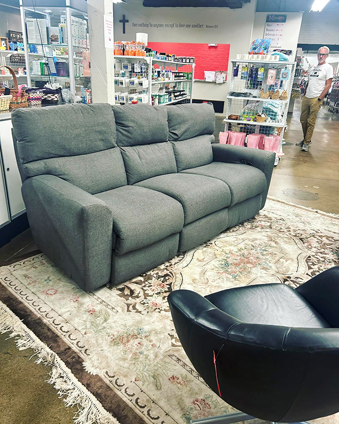 This plush gray sofa looks so pristine, you'd think it teleported directly from a furniture showroom to Mission 27's floor.