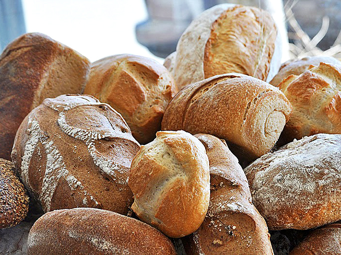 These artisanal sourdough loaves aren't just bread; they're time, patience, and tradition transformed into crackling-crusted perfection.