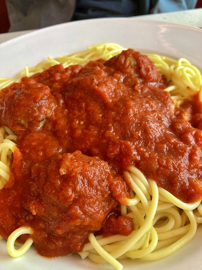 Spaghetti and meatballs that would make any Italian grandmother nod in approval. That sauce isn't just red&mdash;it's a sunset in tomato form.