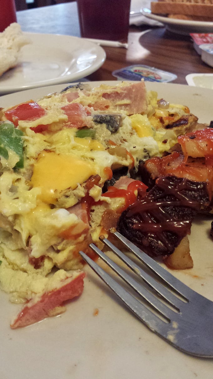 This isn't just an omelet &ndash; it's a colorful canvas of morning possibilities with vegetables playing supporting roles to perfectly cooked eggs.