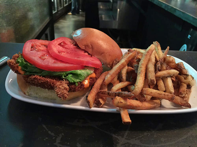 The spicy chicken sandwich &ndash; where crispy coating meets cool vegetables in a relationship that makes Romeo and Juliet look casual.