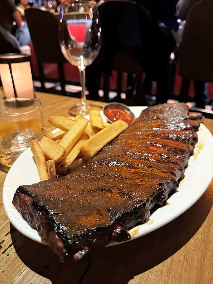 Ribs that would make Fred Flintstone weep with joy, paired with fries that are the perfect vehicle for sopping up that glorious sauce.