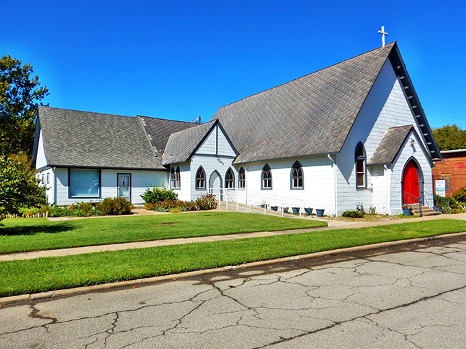 St. Thomas Episcopal Church stands pristine against Oklahoma skies, its white clapboard and red door a picture of small-town spirituality.