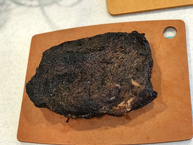 The brisket's mahogany exterior is nature's perfect wrapping paper for the smoky, tender gift waiting inside. Christmas morning for carnivores.
