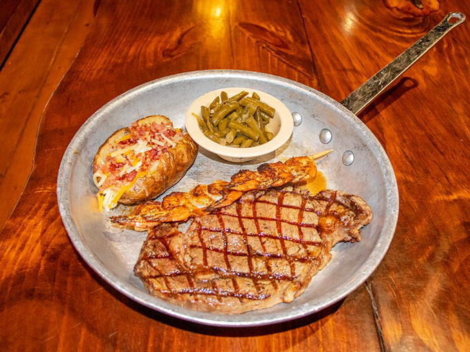Surf meets turf in this Midwest masterpiece&mdash;a perfectly grilled steak and jumbo shrimp with a baked potato that's practically begging for butter.