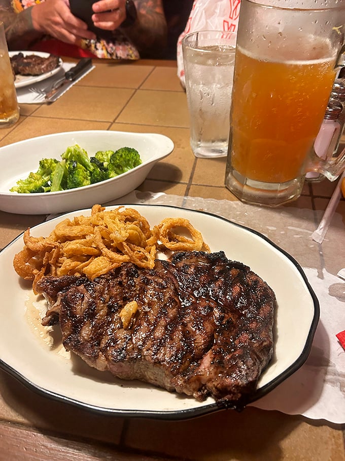 This steak's beautiful crosshatch grill marks tell you someone in the kitchen actually cares. Paired with a loaded potato that's dressed for its own party.