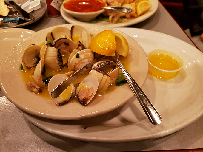 Steamed clams bathing in garlicky broth with lemon lifeguards standing by. Simple perfection that transports you coastside.