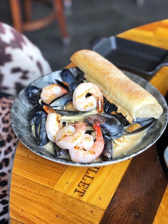 The seafood equivalent of a group hug: Plump mussels and shrimp nestled in a creamy broth with a crusty baguette standing by for dipping duty.