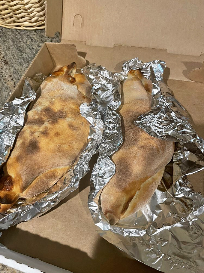 Behold the Nic-o-boli in its natural habitat&mdash;wrapped in foil like the culinary present it is, ready to unleash its cheesy, meaty magic.