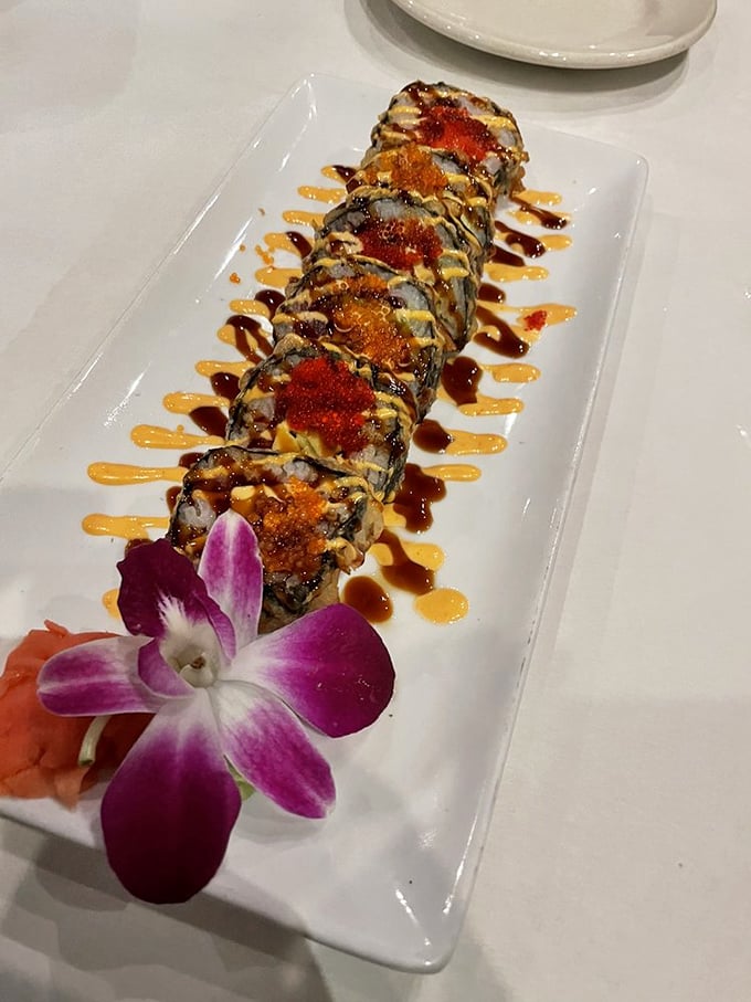This isn't just sushi&mdash;it's edible art with sauces applied like brushstrokes. That orchid isn't just garnish; it's making a statement.