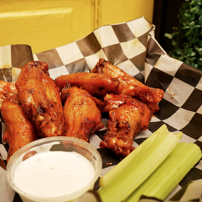 Wings that strike that magical balance between sweet heat and savory satisfaction, with crisp celery standing by for cooling relief.