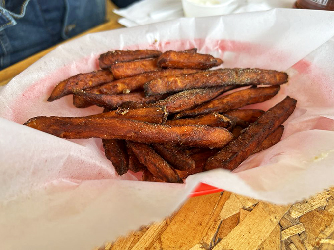 These sweet potato fries aren't just side dishes &ndash; they're supporting actors deserving of their own spotlight, with a perfect crisp-to-soft ratio and subtle sweetness.
