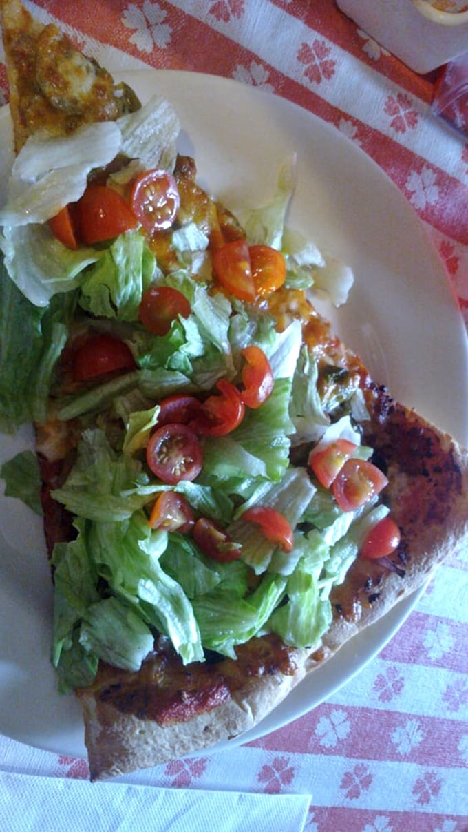 Who needs Taco Tuesday when this pizza exists? Fresh lettuce and tomatoes piled high on a pizza base&mdash;it's the identity crisis that tastes like genius.