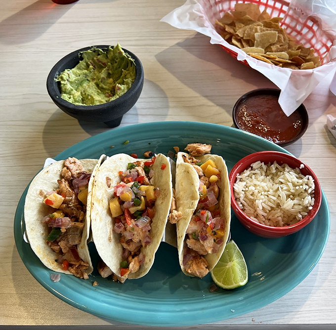 Taco Tuesday arrives even on Thursdays at El Paraiso. Fresh cilantro, diced onions, and a lime wedge&mdash;the holy trinity of taco perfection.
