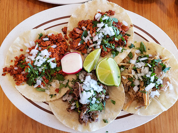 These tacos aren't playing around&mdash;handmade tortillas cradling perfectly seasoned meat, topped with the holy trinity of cilantro, onion, and lime.
