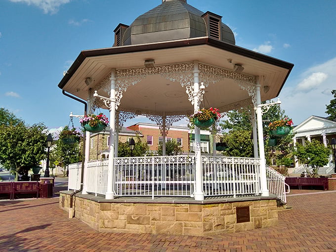 The iconic gazebo gleams white against blue skies, adorned with hanging flower baskets&mdash;the perfect backdrop for summer concerts and inevitable marriage proposals.