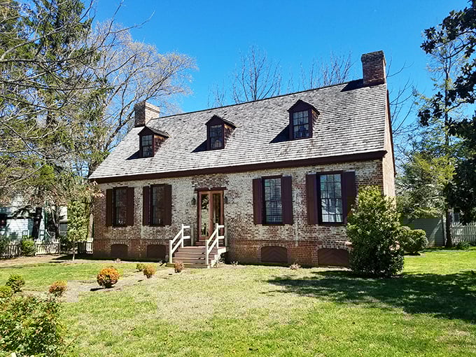 The Wickersham House stands as elegant proof that brick colonial architecture ages like fine wine, while the rest of us just get older.