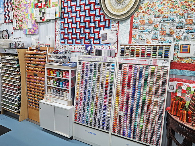 The thread wall &ndash; a textile painter's palette with more color options than a sunset over the Grand Canyon. Finding the perfect match becomes a joyful treasure hunt.