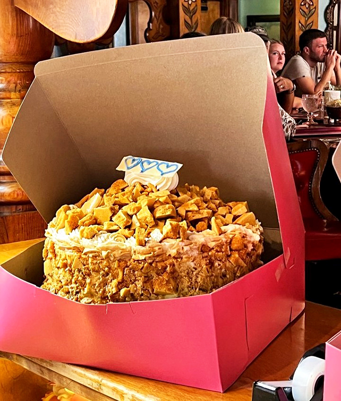 A cake so impressive it gets its own pink throne of a box. This toffee crunch creation isn't just dessert&mdash;it's an event.