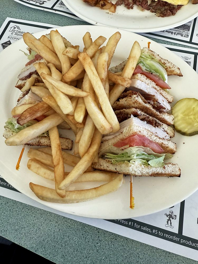 The club sandwich—triple-decker architecture that would make Frank Lloyd Wright proud. Notice how those toothpicks are structural, not decorative.