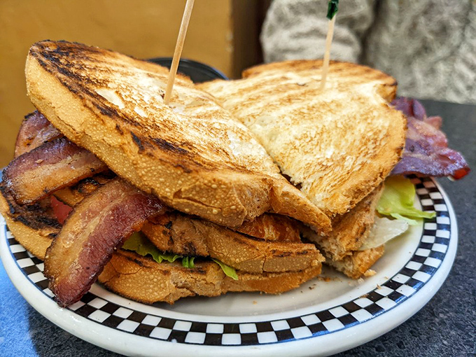 The club sandwich&mdash;architecture you can eat. Three stories of toasted goodness held together by those little wooden picks that somehow make everything taste better.