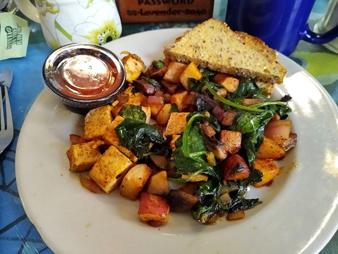 Who says vegan can't be hearty? This colorful tofu scramble with potatoes and greens would convert even the most dedicated carnivore.