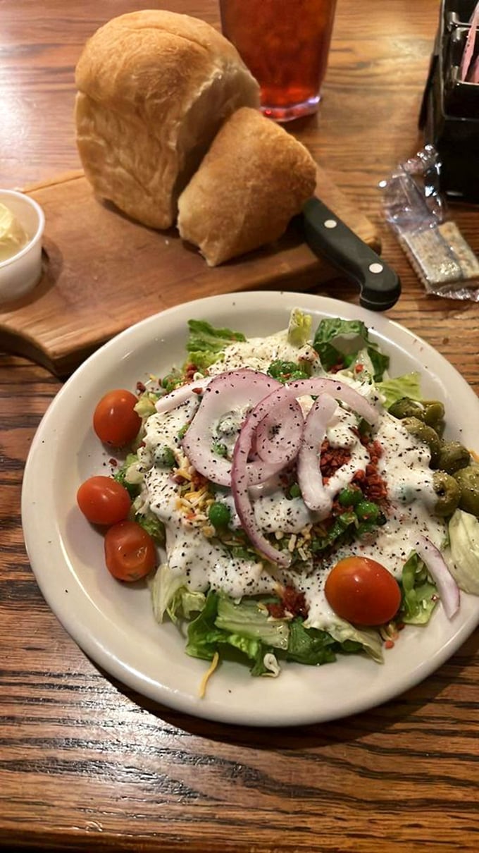 A garden-fresh salad that makes eating vegetables feel like an indulgence. That homemade bread standing guard makes this a perfect opening act.