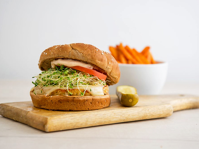 Even in a temple of meat, plant-based options shine. This veggie burger with sprouts isn't an apology&mdash;it's a declaration that vegetarians deserve joy too.