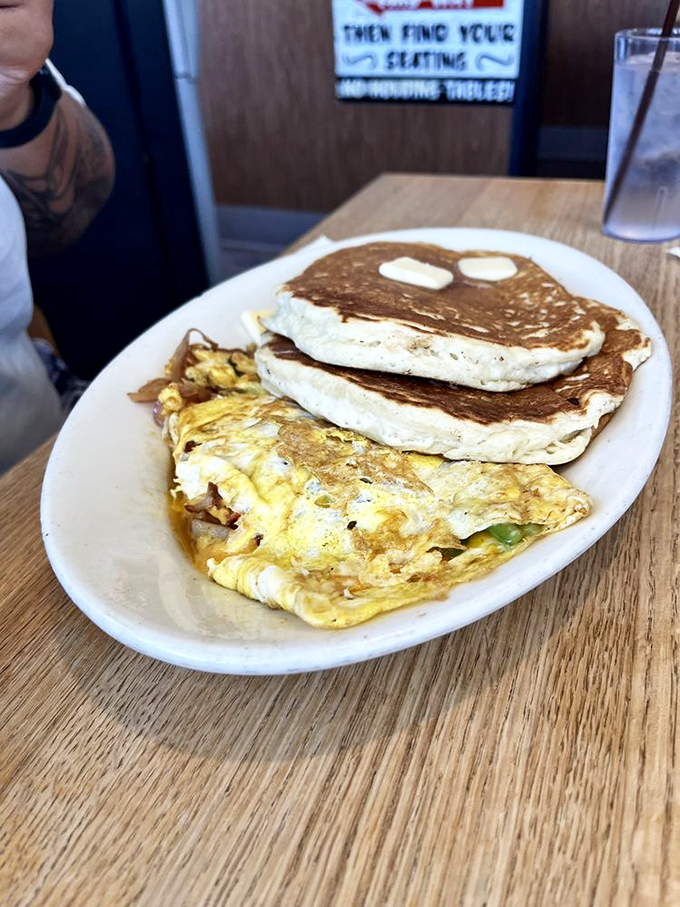 The dynamic duo of diner perfection&mdash;a fluffy omelet that's seen the vegetable drawer and hotcakes that make pancake mix commercials weep with inadequacy. 